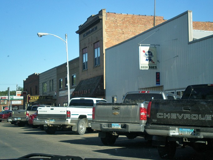 Pickup trucks parked downtown tell you everything about Kenmare: practical, unpretentious, and perfectly suited for simple retirement living.