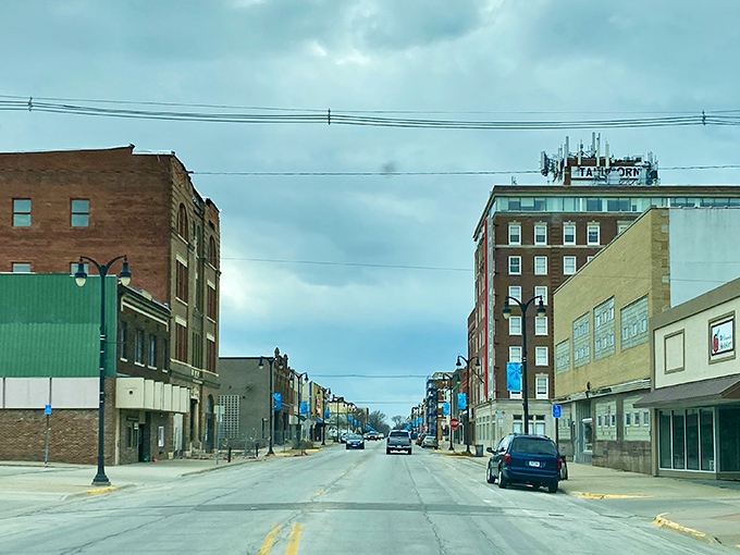 Downtown Marshalltown's historic buildings stand tall against Iowa's big sky, like architectural time travelers refusing to budge.