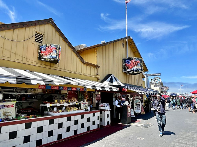Old Fisherman's Grotto's cheerful yellow building brightens Monterey's wharf. A sunshine-colored landmark that's been feeding happy visitors for generations.