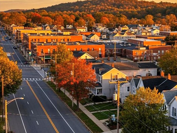 Residential streets in Pennsauken feature modest homes with yards, providing affordable housing options for fixed-income seniors.