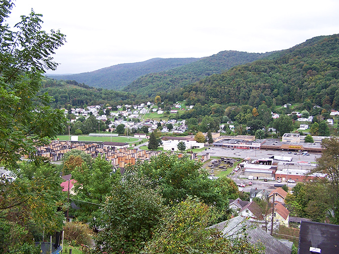 Richwood's quiet main street showcases historic buildings against a mountain backdrop, where life moves at the unhurried pace small-town residents treasure.