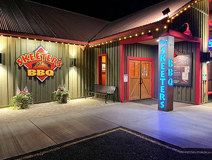 Skeeter's neon glow and string lights transform this metal building into a BBQ wonderland after dark.
