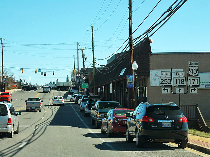 Highway signs point toward adventure and away from the high costs of city living.