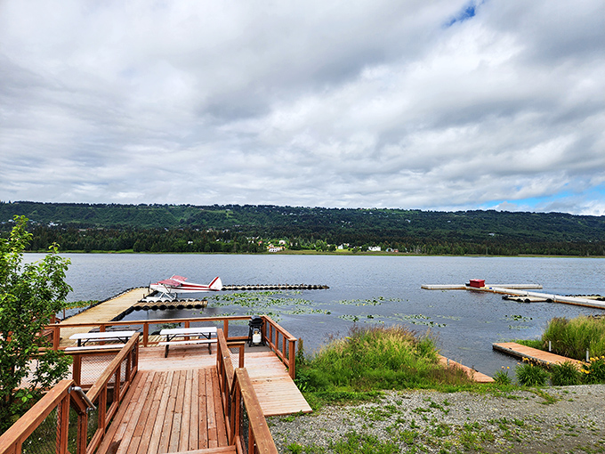 Wooden docks stretch into crystal waters where seaplanes rest, offering Homer residents their own backyard paradise.