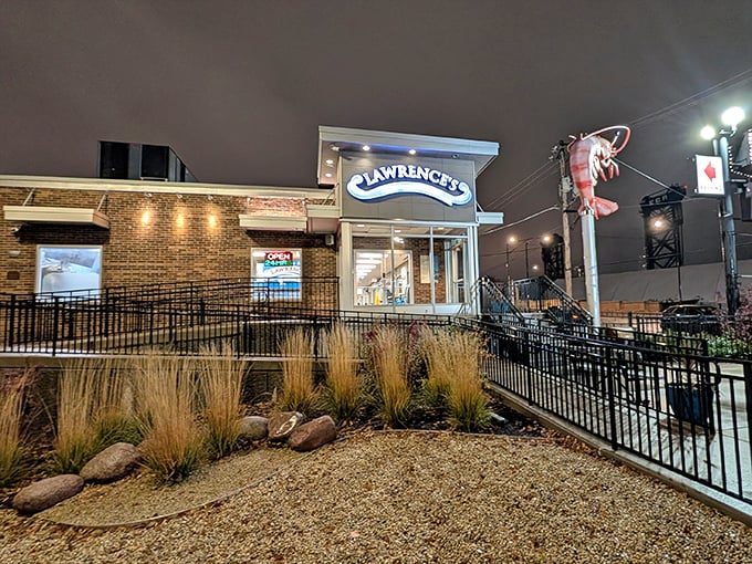 Evening lights make Lawrence's glow like a seafood sanctuary, beckoning hungry pilgrims to worship at the altar of fried perfection.