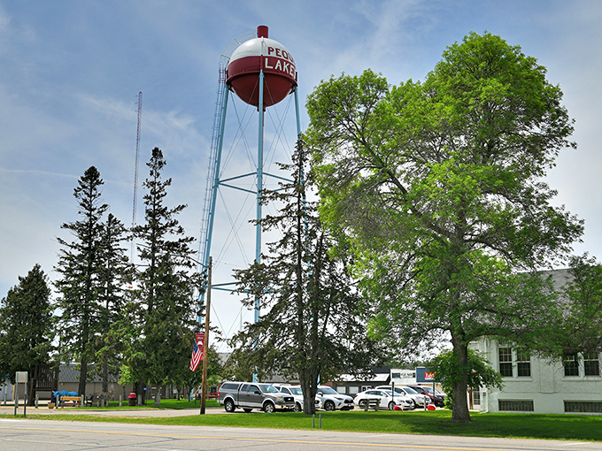 The red and white water tower of Pequot Lakes stands tall among the trees like a fishing bobber waiting for the big catch.