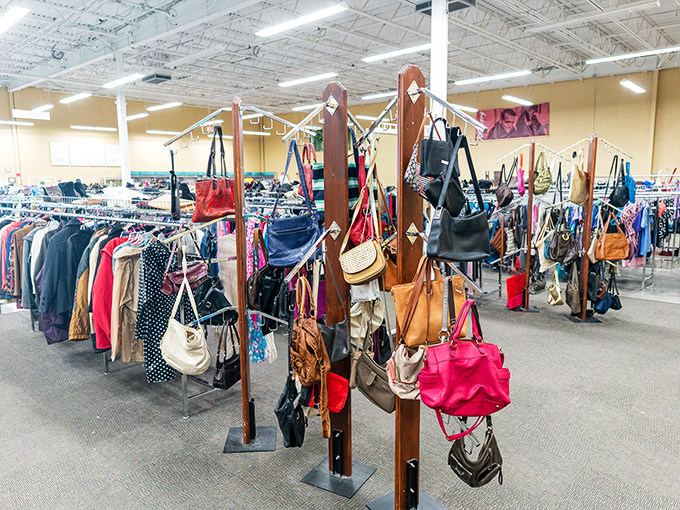Handbags of every color and style hang like exotic fruit, waiting to be plucked by fashion-forward bargain hunters.