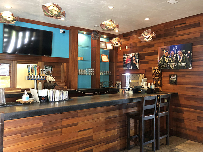 The bar area says "we're serious about drinks" while the fish decorations remind you you're definitely in Hawaii. Island casual meets functional design.