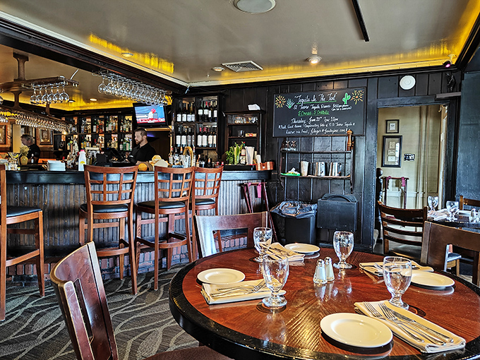 The bar area beckons with its dark wood and amber lighting&mdash;the kind of place where strangers become friends over perfectly mixed manhattans.