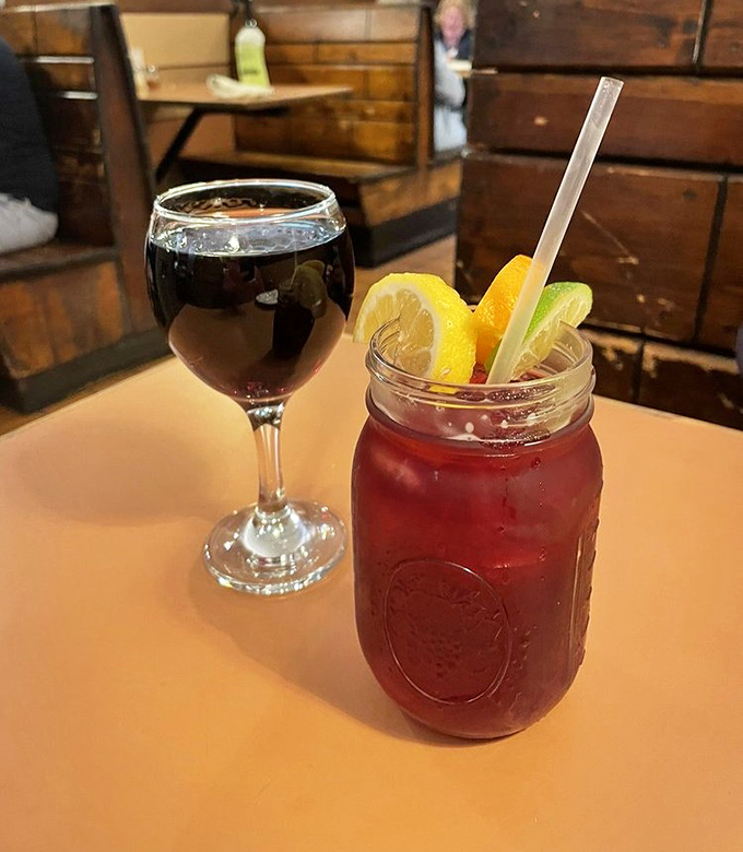 The perfect companions to pizza perfection&mdash;a robust red wine and what appears to be their signature sangria, garnished for maximum enjoyment.