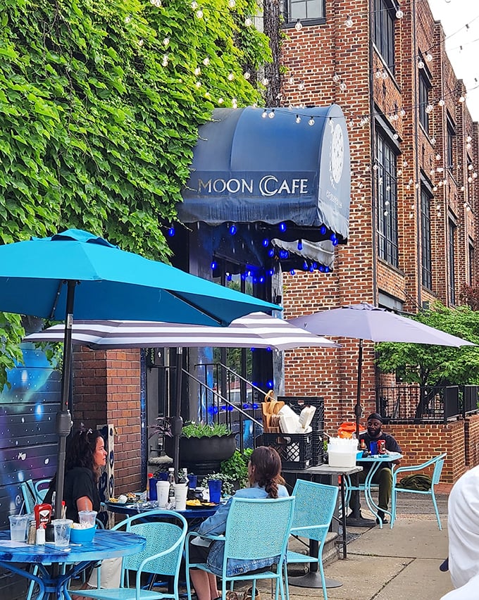 Blue Moon Cafe's outdoor seating invites leisurely brunches and people-watching. Those blue chairs aren't just furniture&mdash;they're front-row seats to Baltimore's neighborhood theater.