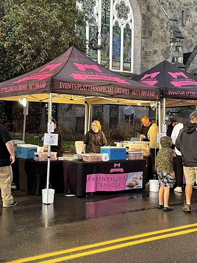 Fresh-filled cannoli under festival tents—proof that some of life's greatest pleasures still come wrapped in simple packaging rather than complicated apps.