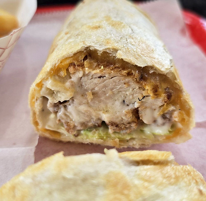 Peek inside this wrap and discover a world where chicken, ranch, and veggies live in perfect harmony. It's edible architecture.
