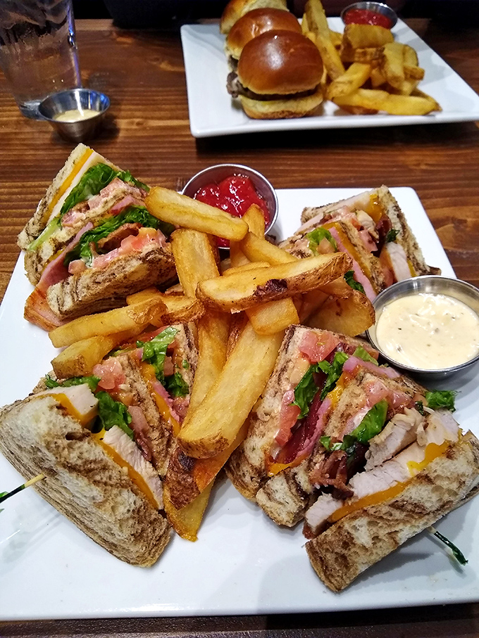 A club sandwich that stands tall and proud, like the architectural lovechild of a skyscraper and comfort food.