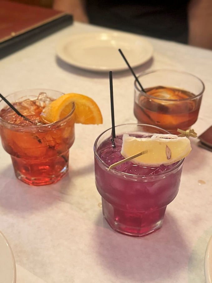 The holy trinity of classic cocktails, lined up like old friends waiting to hear about your day.
