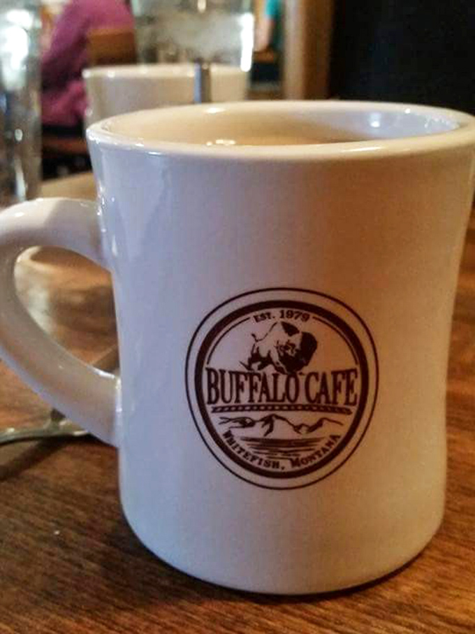 Their sturdy coffee mug promises unlimited refills and mountain views. The buffalo logo reminds you this isn't just coffee—it's fuel for Montana adventures.