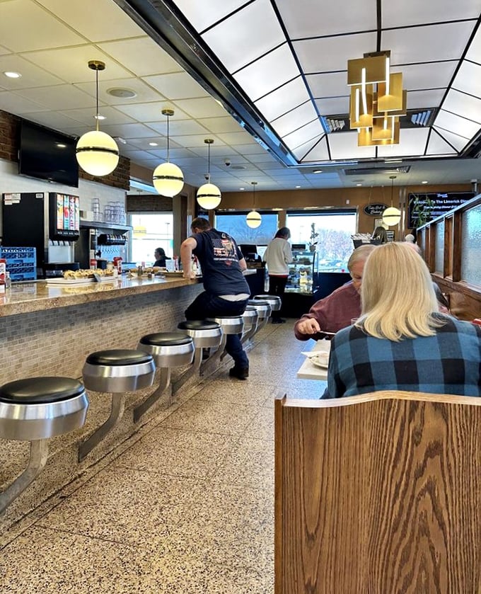 The counter seating&mdash;where solo diners become regulars and the coffee keeps flowing as freely as the conversation.