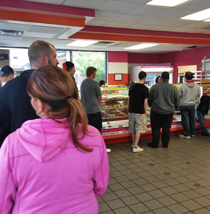 The universal language of donut anticipation. Everyone in line knows good things come to those who wait&mdash;especially when frosting is involved.