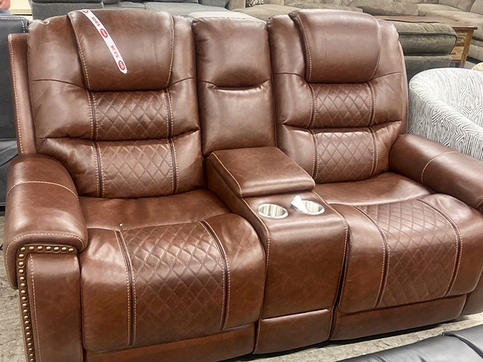 This leather loveseat with console isn't just furniture &ndash; it's relationship therapy with built-in cup holders and personal space.