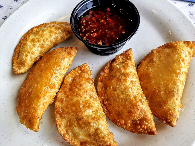 Duck bacon wontons: proof that innovation and tradition can coexist deliciously on the same plate, especially with that sweet-spicy dipping sauce.