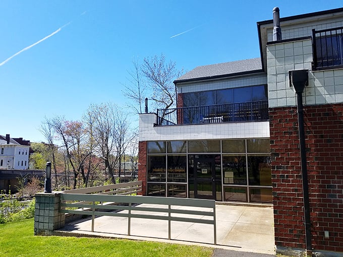 The Exeter Public Library welcomes visitors with brick and glass, promising adventures that require no passport—just a library card.