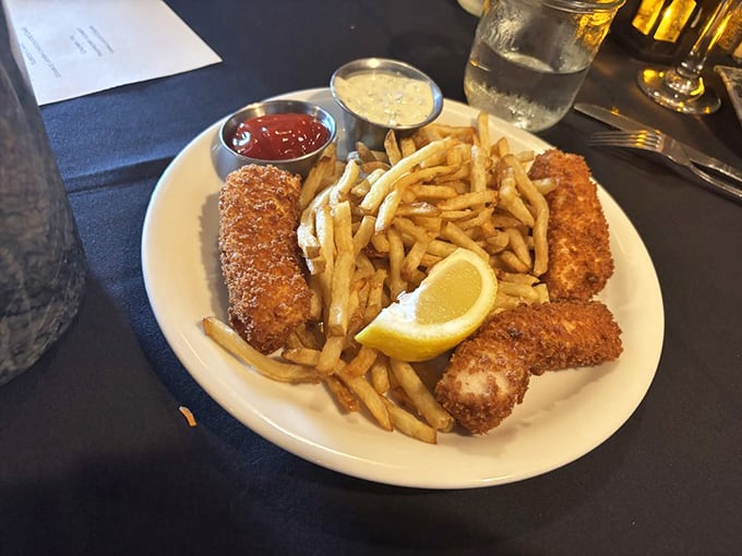 Fish and chips that would make a British pub jealous, with a golden crust that crackles like a love letter to deep-frying.