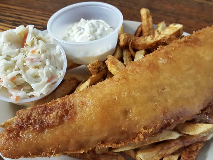 Fish and chips that crackle with each bite, served with coleslaw that adds just enough tang to cut through the richness.