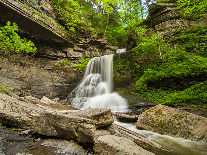 This waterfall doesn't just flow &ndash; it performs, cascading down the rock face with the grace of a natural ballet dancer.