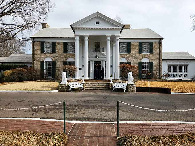 Graceland's stately entrance appears deceptively modest, giving little hint of the rhinestone-studded, jungle-roomed wonderland waiting inside.