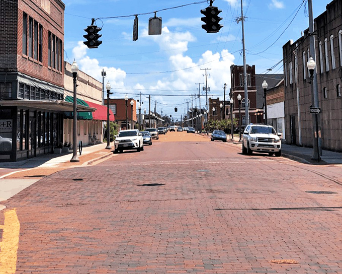 Sunlight plays across Greenwood's historic brick streets, where traffic jams are as rare as reasonably priced big-city apartments.