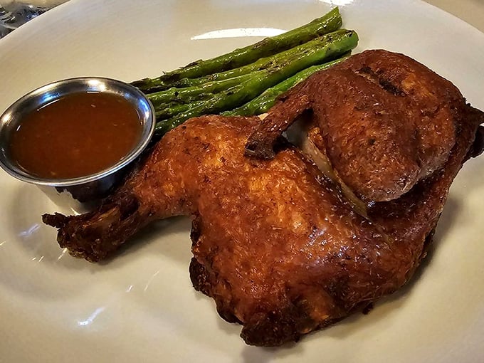 This half chicken isn't just roasted&mdash;it's been transformed into a golden-brown masterpiece of crispy-juicy perfection.