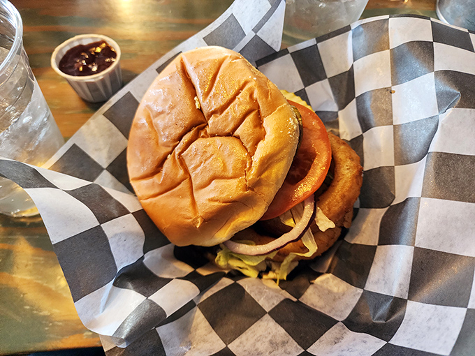 A burger that demands to be photographed before being eaten. This isn’t just a sandwich—it’s an architectural achievement.