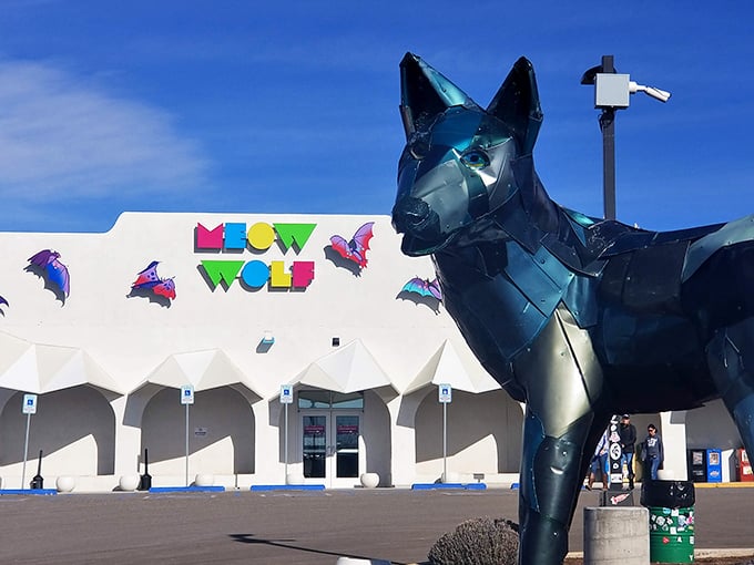 Meow Wolf's massive blue wolf guards the House of Eternal Return like a sentinel from another dimension, promising mind-bending adventures inside.