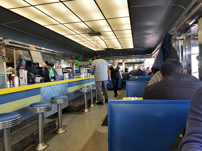 The diner's blue and yellow color scheme isn't just decoration&mdash;it's a mood enhancer that says "happiness served here daily."