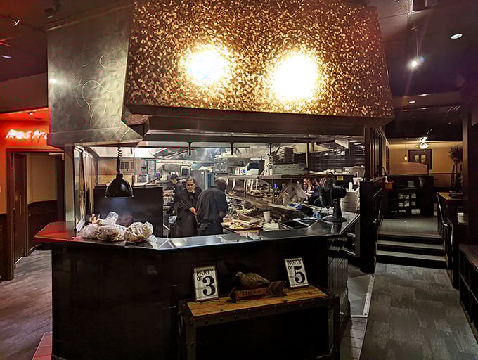 The open kitchen design lets you watch culinary magic happen &ndash; like peeking behind the curtain at a delicious wizard's workshop.