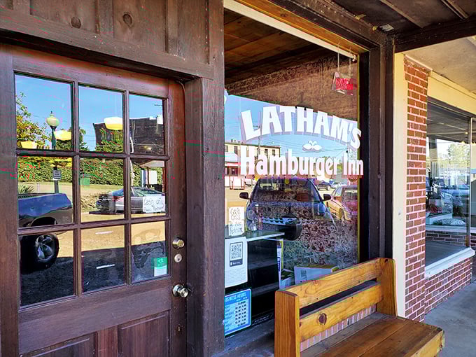 Latham's Hamburger Inn's wooden door might as well be a time portal. Behind it waits the kind of honest burger that made America great before "gourmet" was invented.