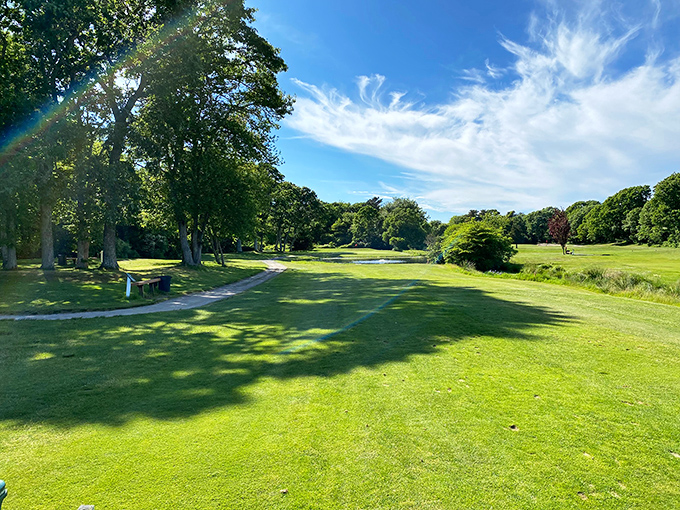 Little Harbor Golf Course invites players to chase little white balls across perfectly manicured greens under the watchful gaze of ancient trees.