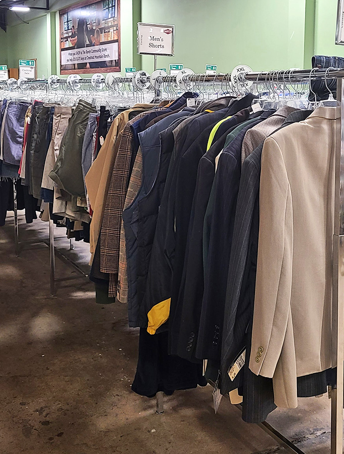 Men's suits and jackets hang like a meeting of distinguished gentlemen waiting for their next important occasion.