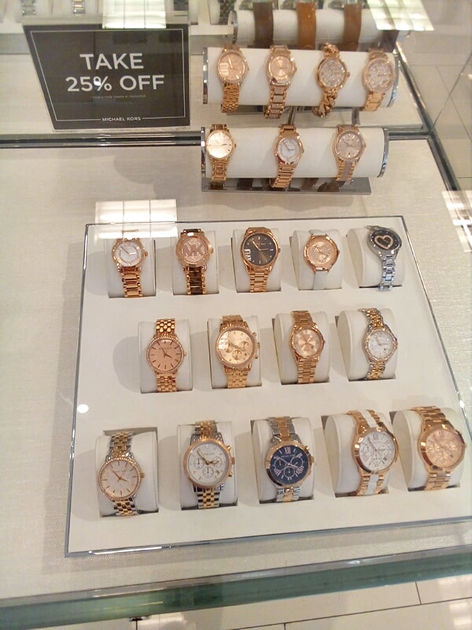 Michael Kors watches gleam under display lights, tempting you to check the time in style while saving some serious cash.
