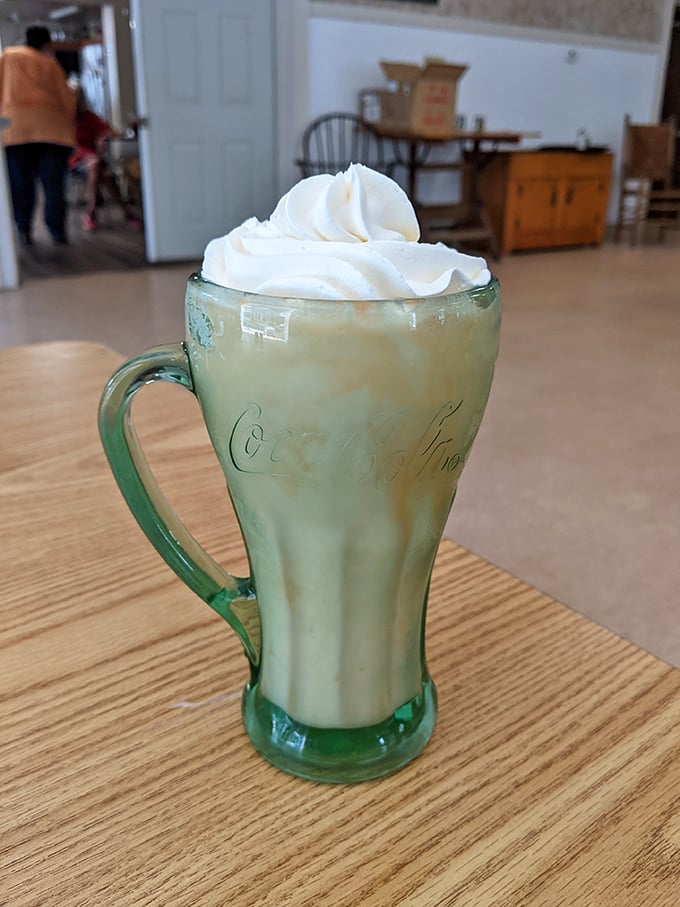 That vintage green Coca-Cola glass isn't just serving a milkshake&mdash;it's delivering a time machine back to simpler, sweeter days.