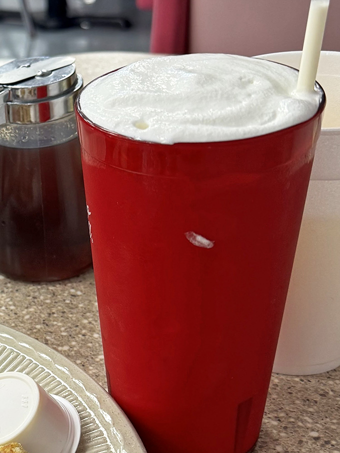 This isn't just a milkshake, it's a frothy red monument to simpler times when desserts didn't need to be Instagram-worthy to be utterly satisfying.