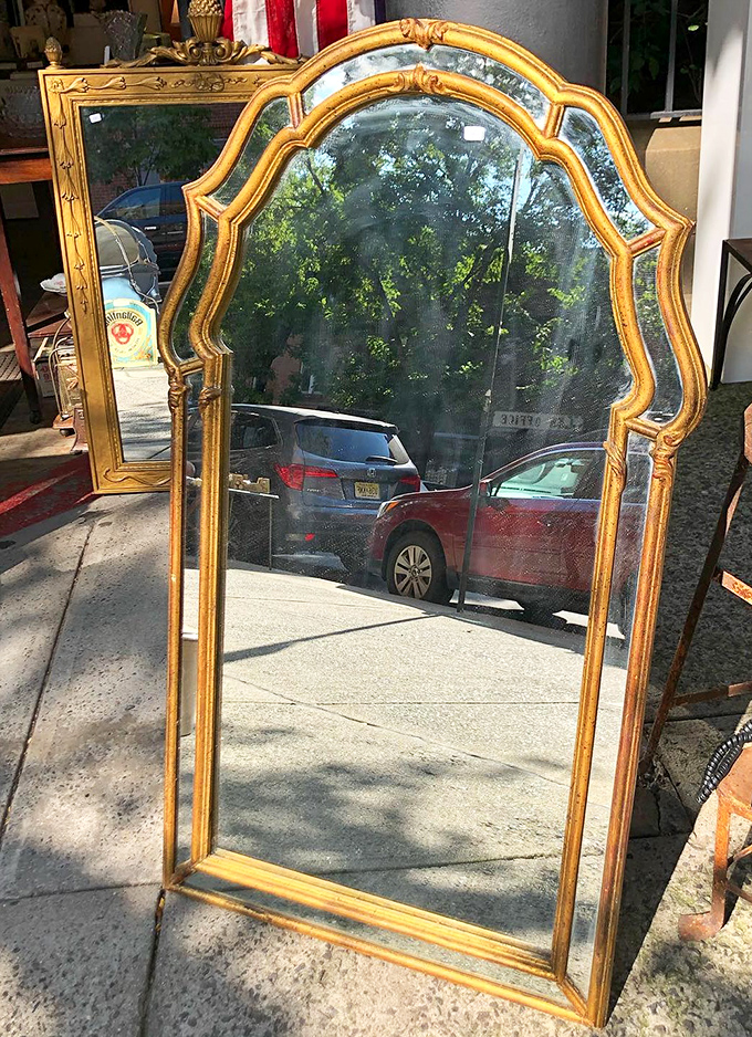 A gold-framed mirror that's reflected a century of faces&mdash;imagine the outfits, hairstyles, and expressions it's silently witnessed.