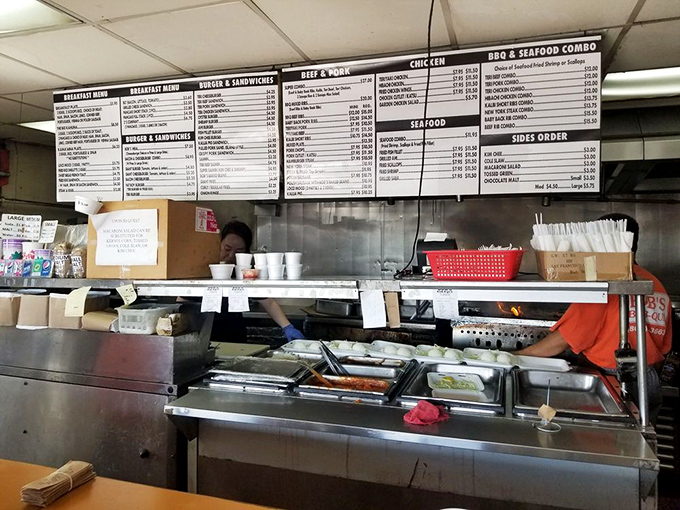 The open kitchen where magic happens without pretense. No tweezers or microgreens here&mdash;just skilled hands and decades of know-how.