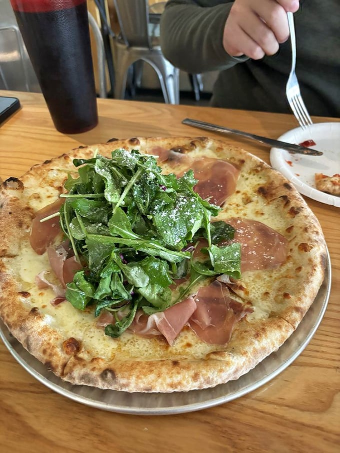 Prosciutto and arugula pizza: where Italy meets Ohio in a perfect marriage of peppery greens and paper-thin pork that melts on contact.