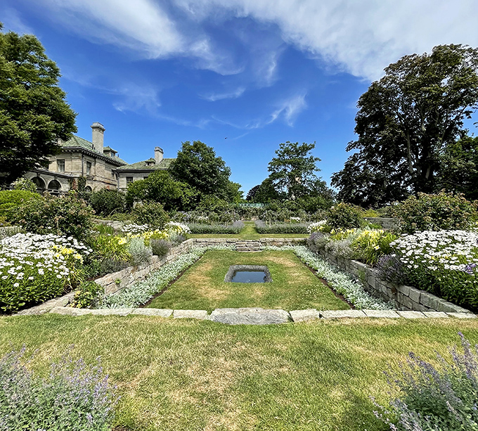 Gardens that frame the mansion like a living picture frame, proving that sometimes the best landscaping is simply knowing when to stop.