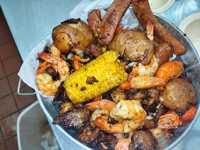A seafood boil that looks like it was prepared by someone who learned the secret handshake of flavor. Messy perfection in a bucket.