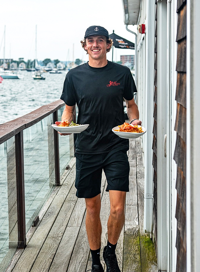 The unsung heroes of seafood paradise, delivering ocean treasures with a smile and the steady gait of someone who knows these boards well.