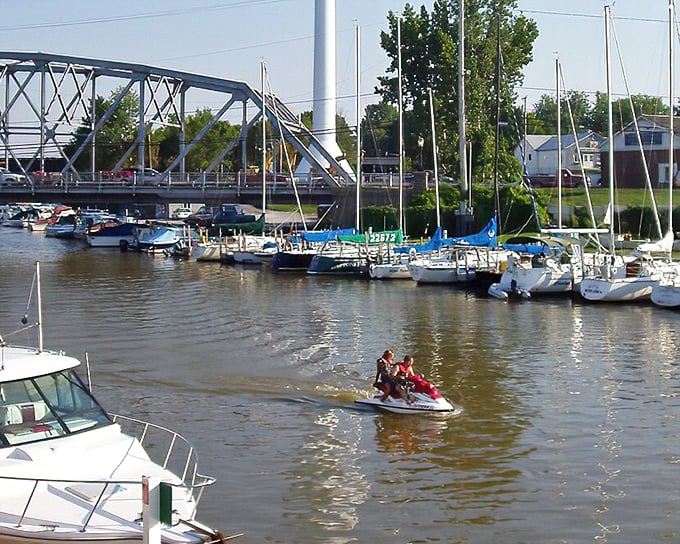 The Vermilion River marina showcases a perfect harmony of leisure craft beneath the bridge&mdash;a scene that makes even non-sailors suddenly interested in learning the difference between port and starboard.
