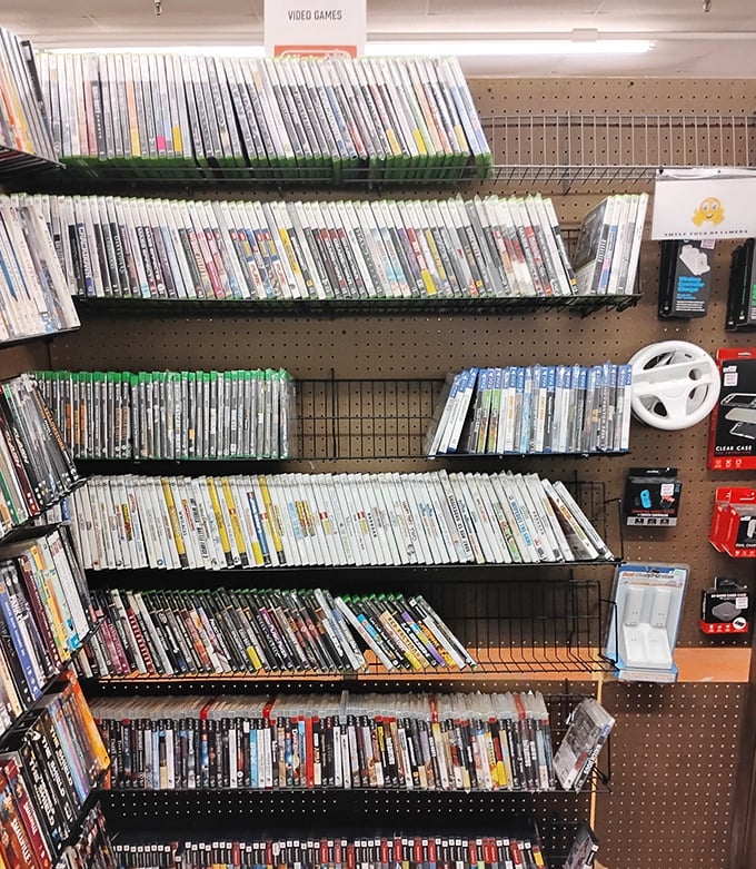 Gaming nostalgia fills these shelves, each case a portal to adventures past, with titles spanning generations of button-mashing memories.
