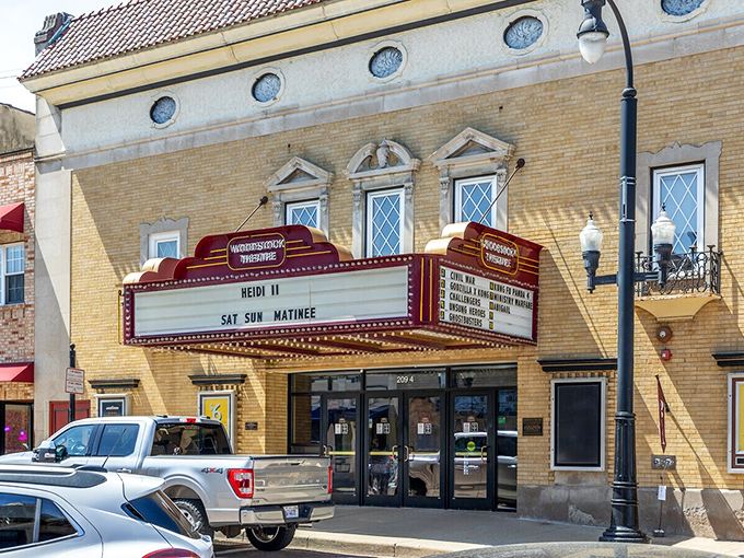 The Woodstock Theatre's marquee glows with promise, offering entertainment the way it was meant to be&mdash;communal, nostalgic, and without a pause button.